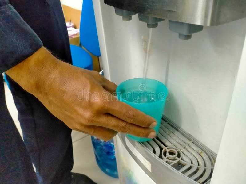 The Water Drop in the Water Dispenser Stock Photo - Image of yellow ...
