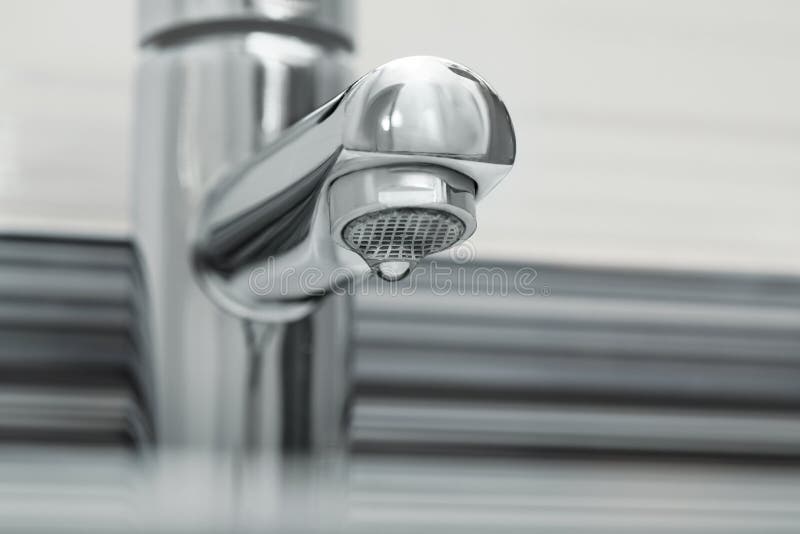 Water Drop Falling Down from Tap in Bathroom, Closeup Stock Photo ...