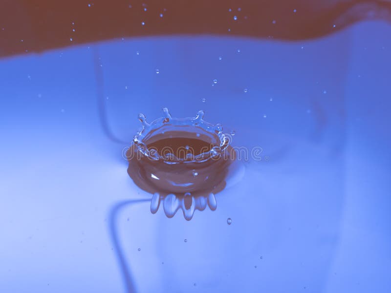 Water Drop Falling and Drips in Colored Glass Stock Photo - Image of ...