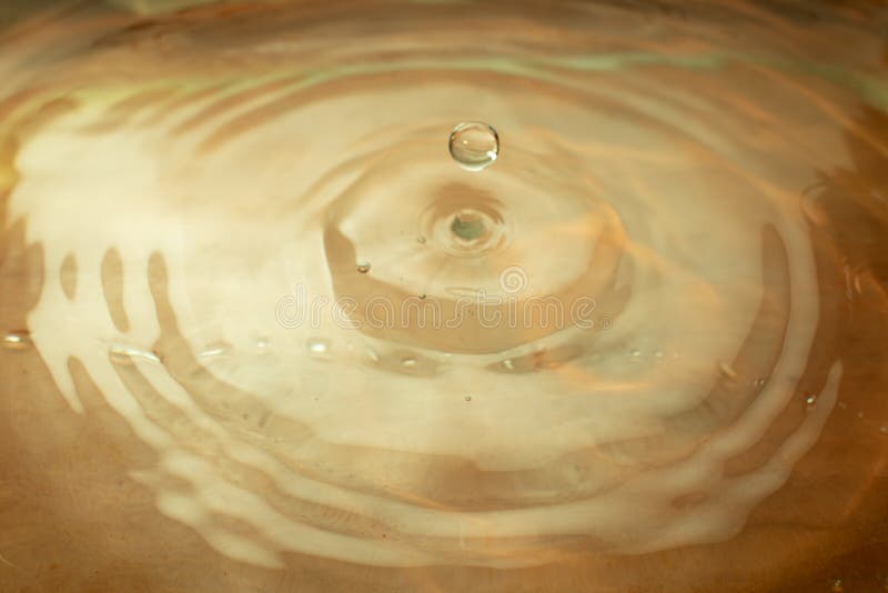 Water Drop Falling and Drips in Colored Glass Stock Image - Image of ...