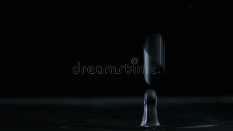 Drop of Water Falls on the Water Surface in Slow Motion, Macro Shot ...