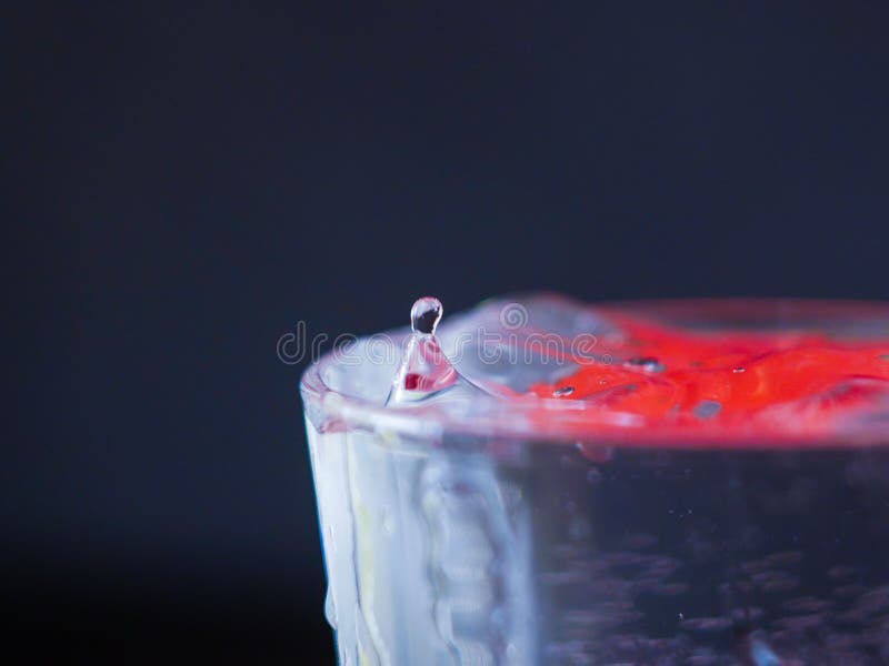 Water Drop in Glass on Dark Bacground, Close Up Stock Photo - Image of ...