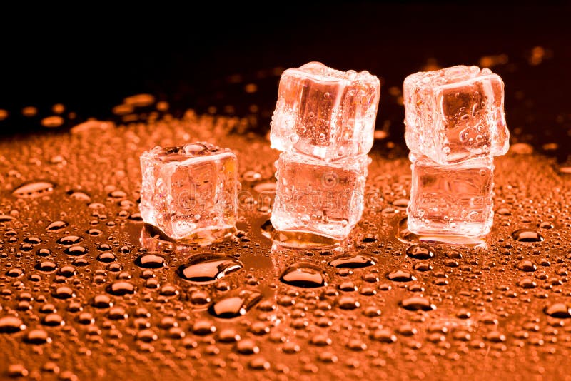 Water Drop with Ice Cubes on Lighting Red Background Stock Image ...