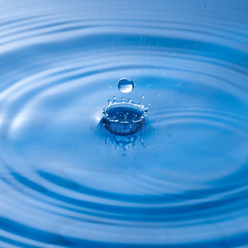 A Water Drop Impact with Water Surface, Causing Rings on the Surface ...