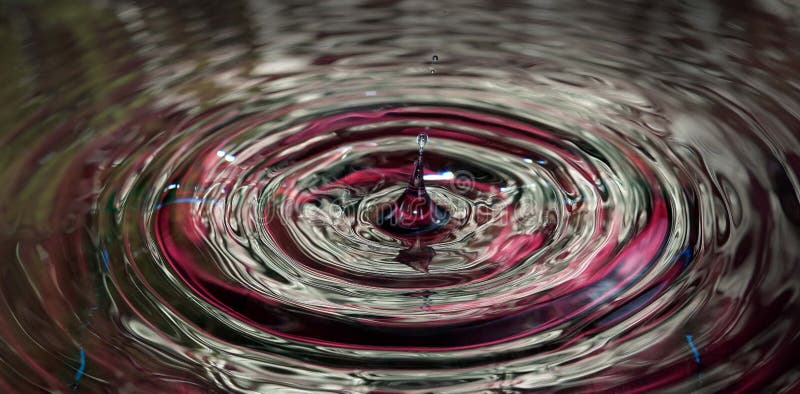 Water drop in red water stock image. Image of closeup - 236010659