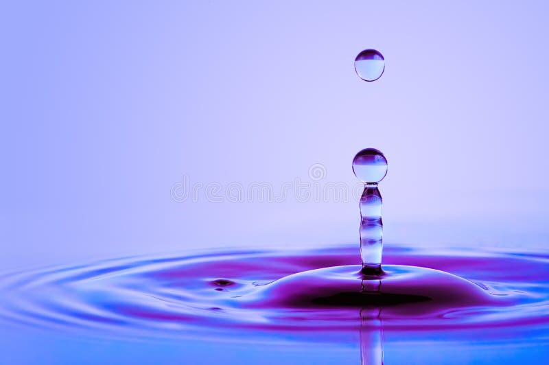 Water Drop in Shades of Blue and Purple Light Stock Photo - Image of ...