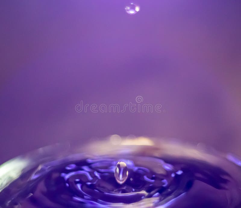Water Drop Splash in a Glass Background Stock Image - Image of blue ...