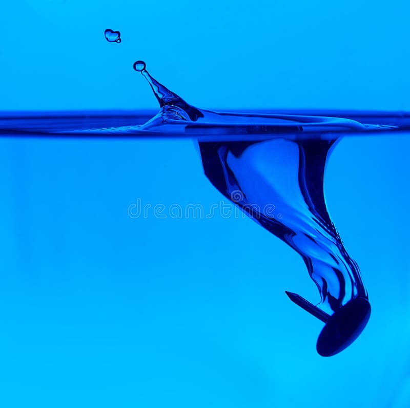 Water Drop Splash in a Glass Blue Colored Stock Image - Image of macro ...