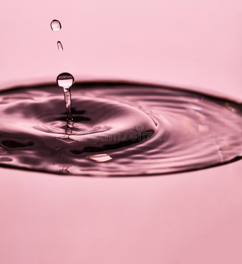 Water Drop Splash in a Glass Blue Colored Stock Photo - Image of macro ...