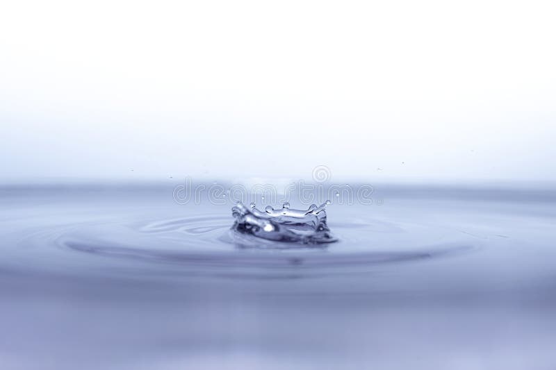 Water Drop Splash in a Glass Blue Colored Stock Photo - Image of water ...