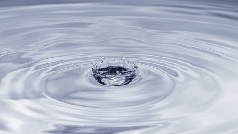 Water Drop Splash in a Glass Blue Colored Stock Image - Image of blue ...