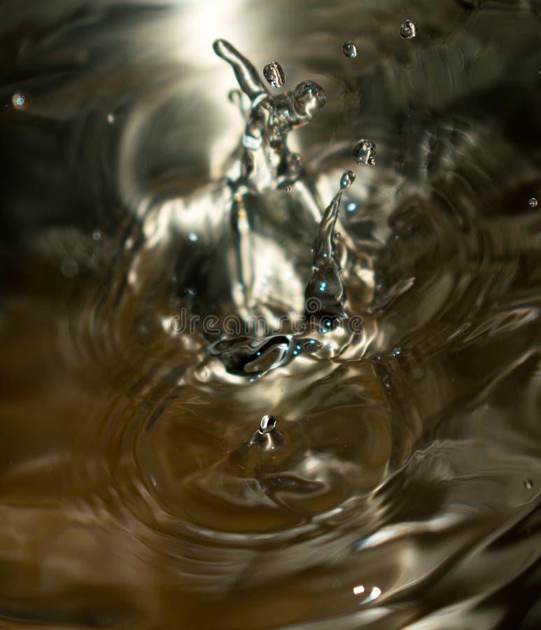 Water Drop Splash in a Glass. Metallic Color Stock Image - Image of ...