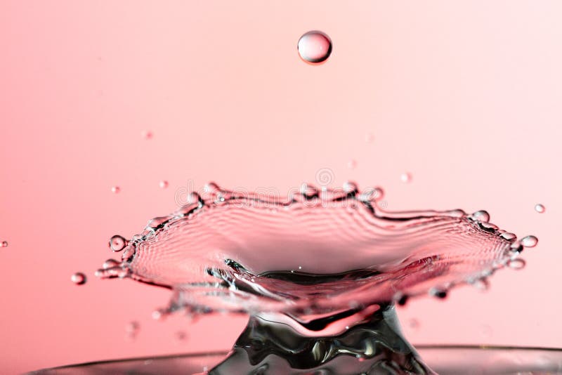 Water Drop Splash with Ripples on Water Surface Stock Photo - Image of ...