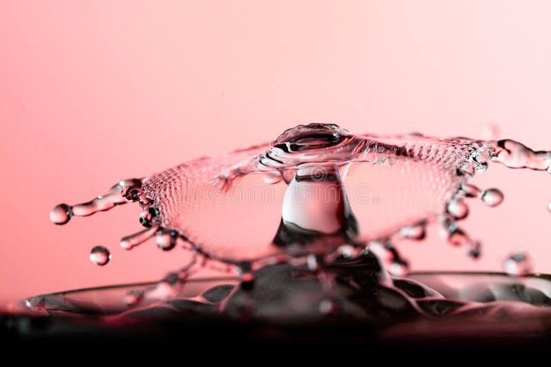 Water Drop Splash with Ripples on Water Surface Stock Photo - Image of ...