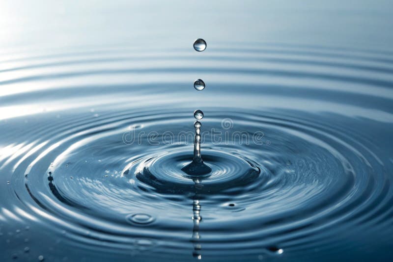 Water Drop Falling into Water Making a Perfect Concentric Circles Stock ...
