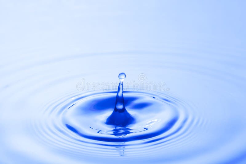 Water Droplet Falling Impact with Water Surface. Causing Rings on Water ...