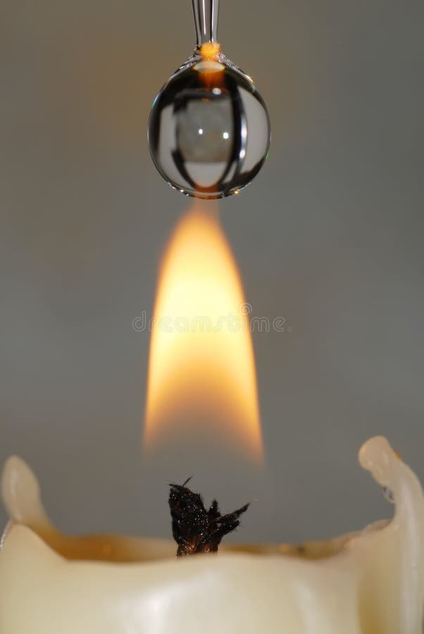 Water Droplet Falling Onto a Candle Flame Stock Photo - Image of light ...