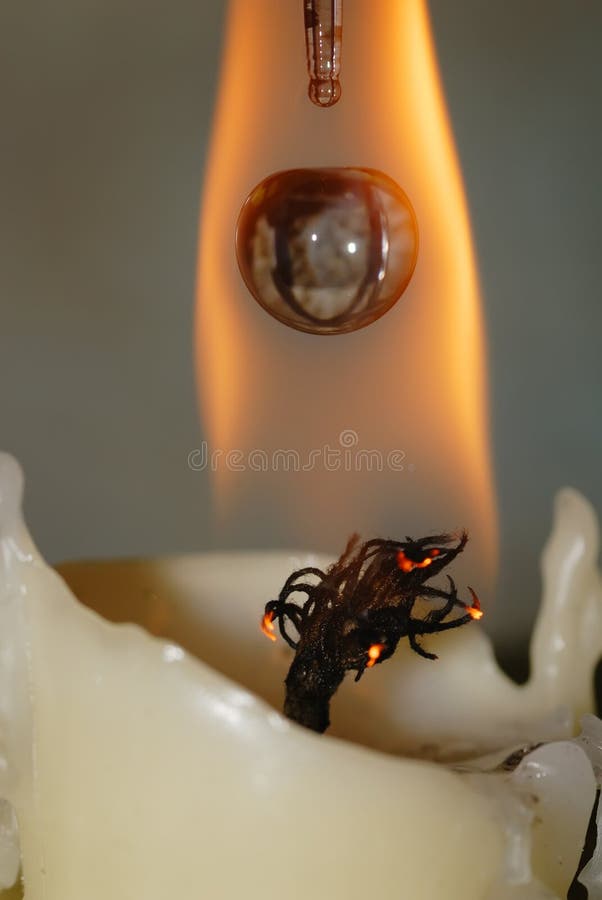 Water Droplet Falling Onto a Candle Flame Stock Photo - Image of ...