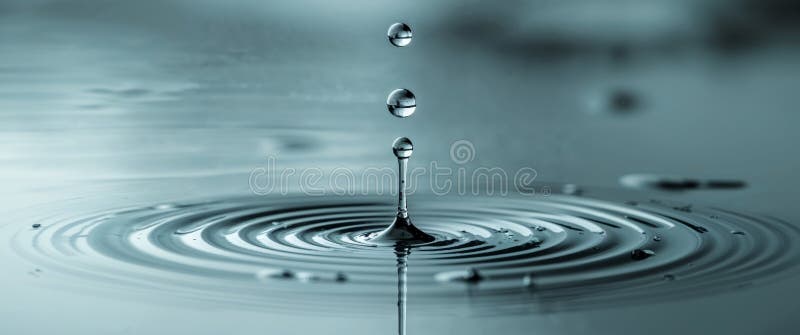 Water Droplet Impact and Ripples in Soft Blue Tones Stock Image - Image ...