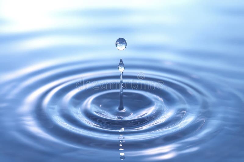Water Droplet Splashing into Calm Rippling Blue Water Surface Stock ...