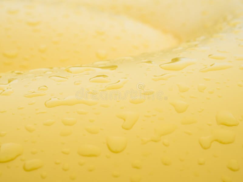 Water Droplet on Surface of Vivid Yellow Pool Float Stock Image - Image ...