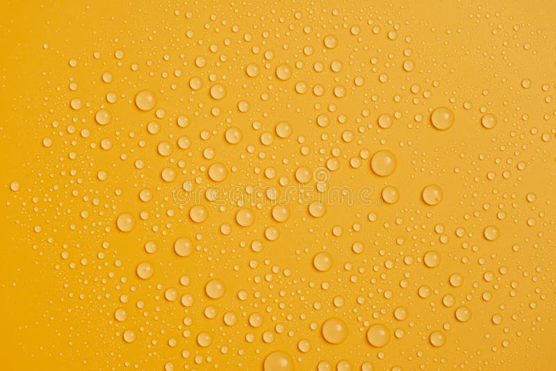 Water Droplets on a Beautiful Yellow Background Stock Image - Image of ...