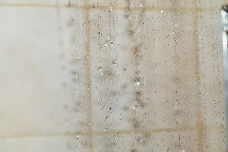Water Droplets Cascade Down a Shower Curtain in a Bathroom Stock Photo ...