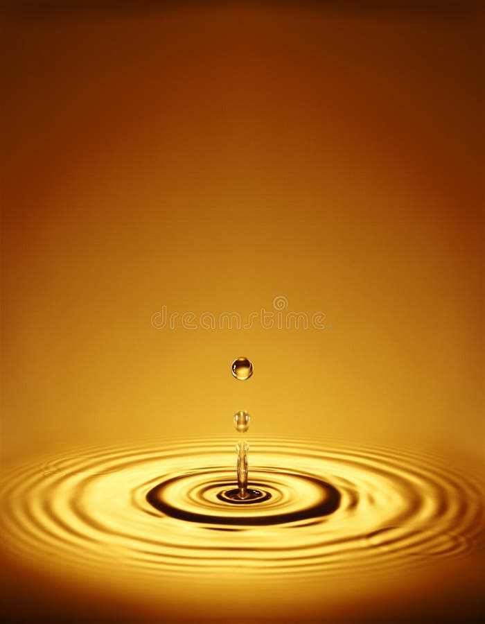 Water Droplets Creating Ripples in Amber Water Stock Photo - Image of ...