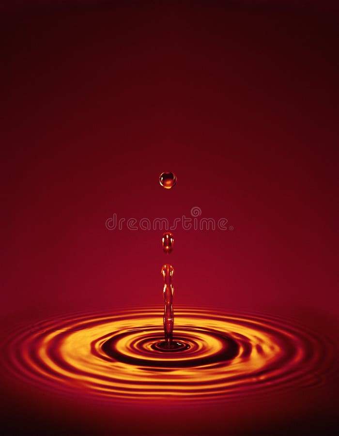 Water Droplets Creating Ripples in Red Water Stock Photo - Image of ...
