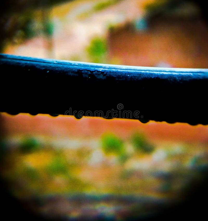 Water Droplets Falling Down from Iron Rod Stock Image - Image of ...