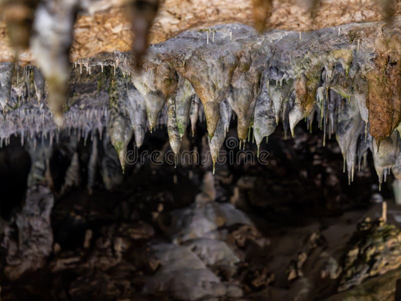 Water Droplets Falling from Stalactites in Cave Stock Image - Image of ...