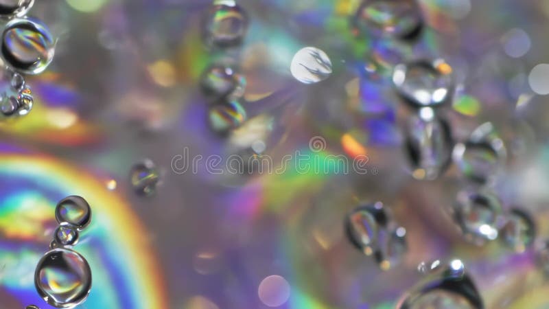 Water Droplets Floating on Iridescent Surface Stock Video - Video of ...