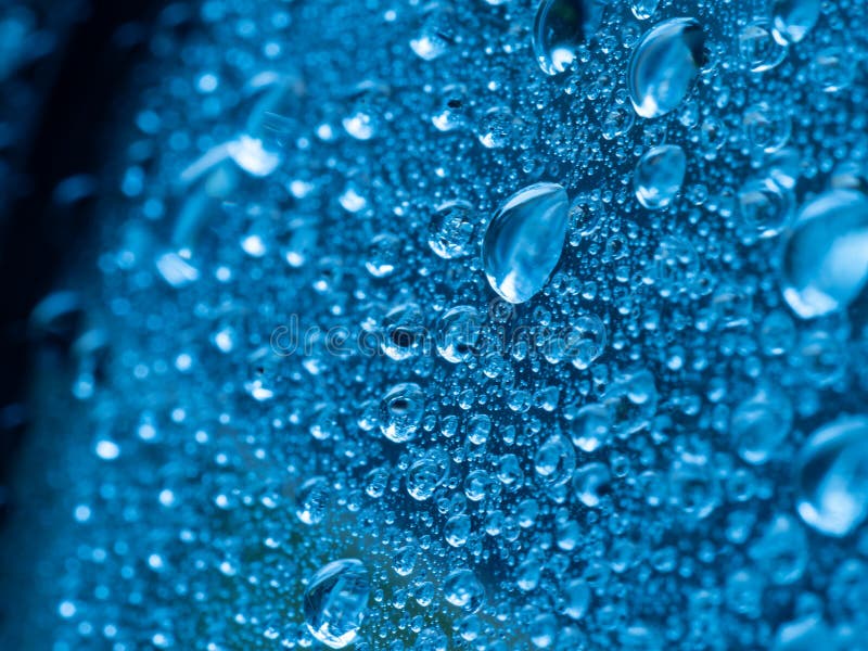 Water droplets on glass stock image. Image of light - 217636581