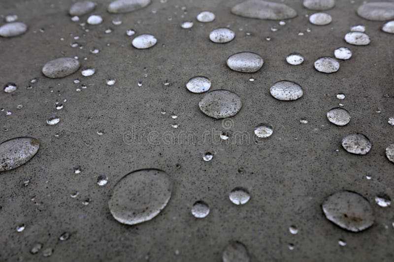 Water Droplets on Grey Ground Stock Image - Image of closeup, detail ...