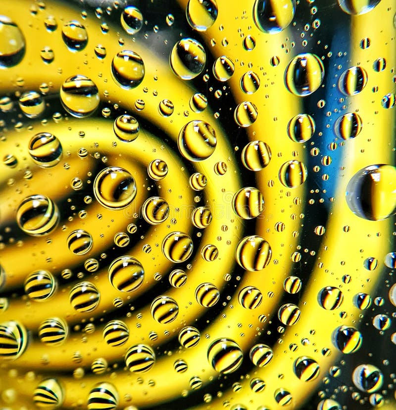 Water Droplets Reflection of Yellow Spiral Stock Image - Image of light ...