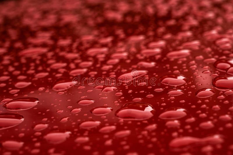 Water Droplets on Shiny Red Metal Stock Image - Image of droplets, fizz ...