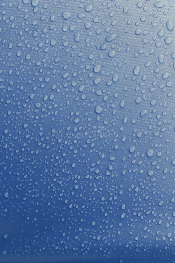 Water Droplets on Top a Textured Blue Surface Stock Image - Image of ...