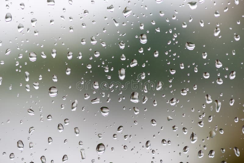 Water droplets on a window stock photo. Image of pure - 160790820