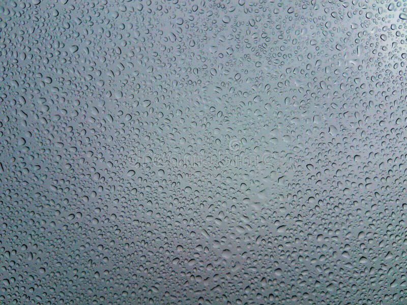 Water droplets on a window stock photo. Image of circle - 180080936