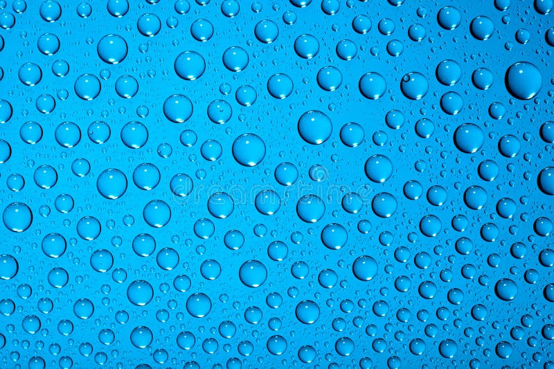 Water drops on blue stock image. Image of light, energy - 23861405