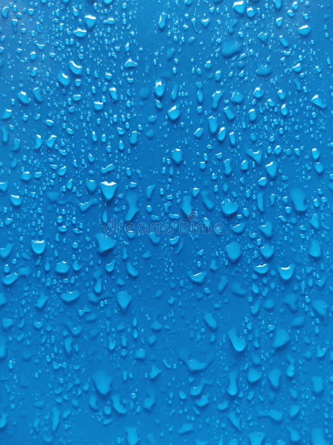 Water Drops in Blue Surface Stock Photo - Image of color, water: 214924396