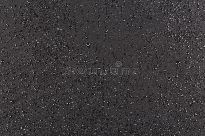 Water drops on dark stone stock photo. Image of raindrop - 86470654