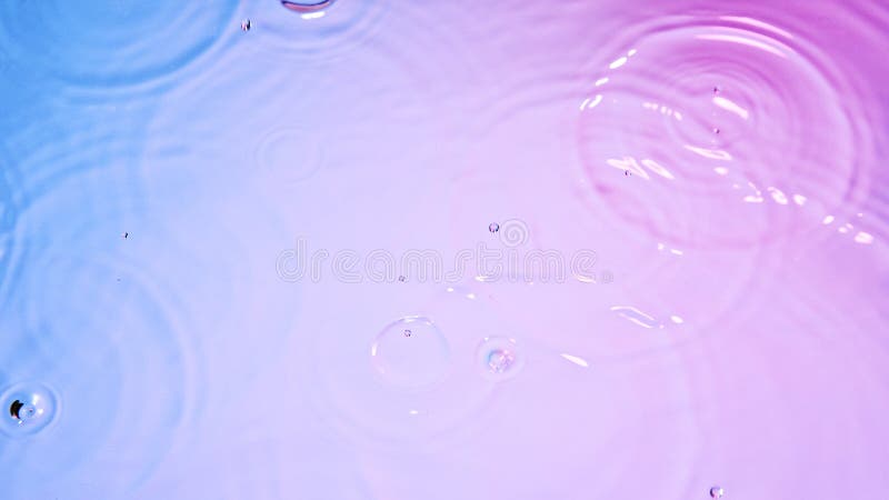 Water Drops Falling on Neon Water Surface Stock Image - Image of clean ...