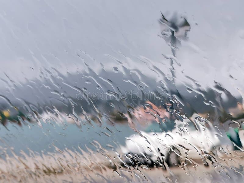 Water Drops On Glass Blurry View Through Window With Rain Drops Stock