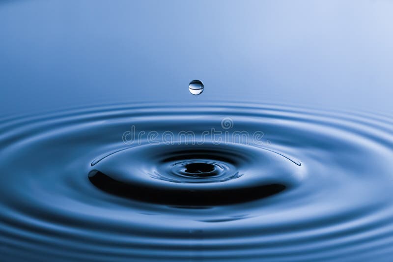 Water Drops Hitting the Clean Surface of the Water Close-up Stock Photo ...