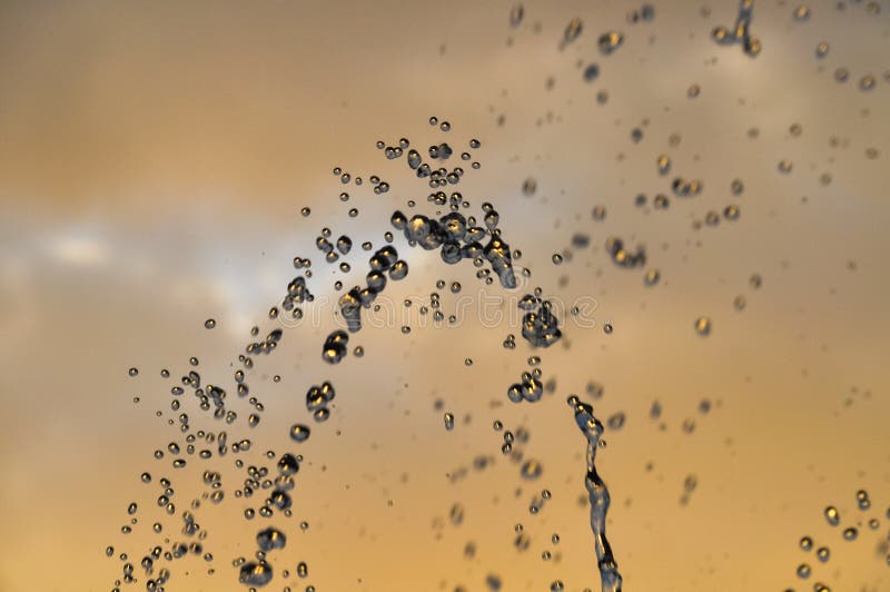 Water Drops Levitation Flying on Sunset Background. Macro Stock Photo ...