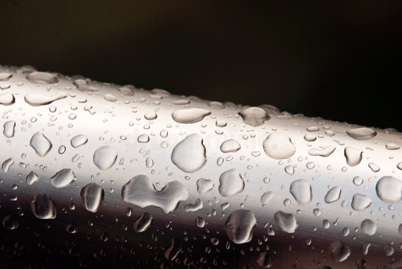 Water drops on metal tube stock photo. Image of close - 23495020
