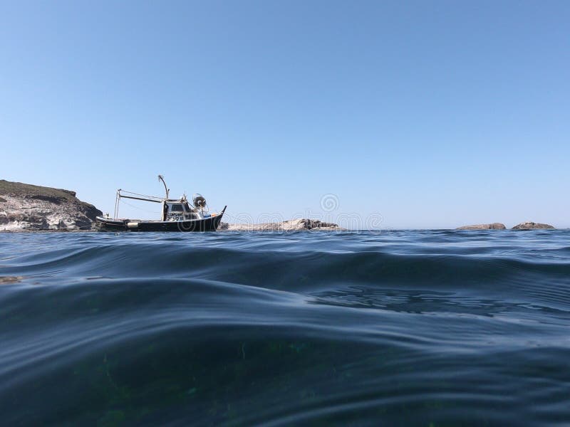 Water Edge with Boat View and Blue Sea Editorial Photography - Image of ...