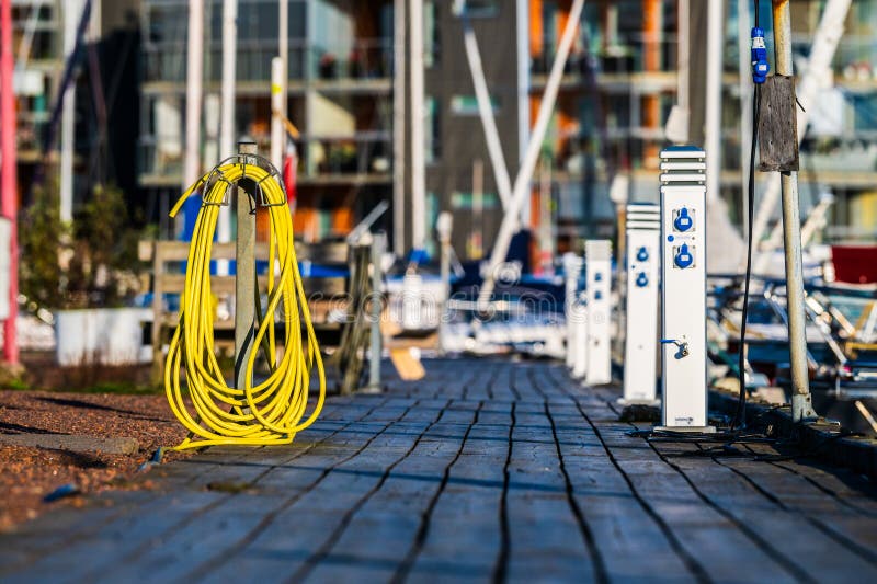 Water and Electricity Poles in a Marina.. Stock Image - Image of ...