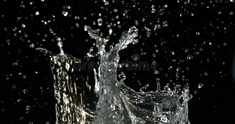 Water Exploding and Splashing Against Black Background Stock Photo ...